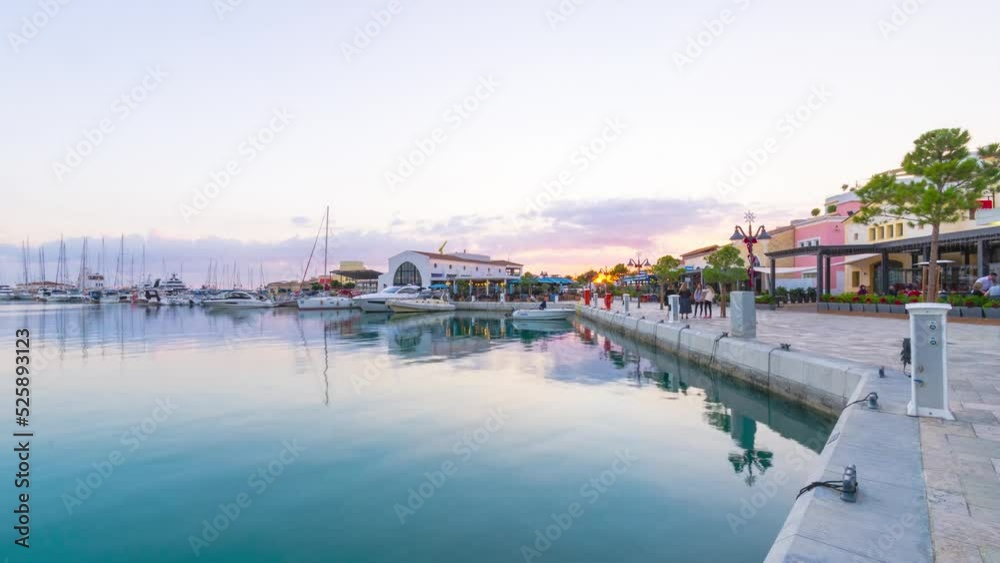 Timelapse footage of sunset at Limassol Marina, Cyprus. People walking ...