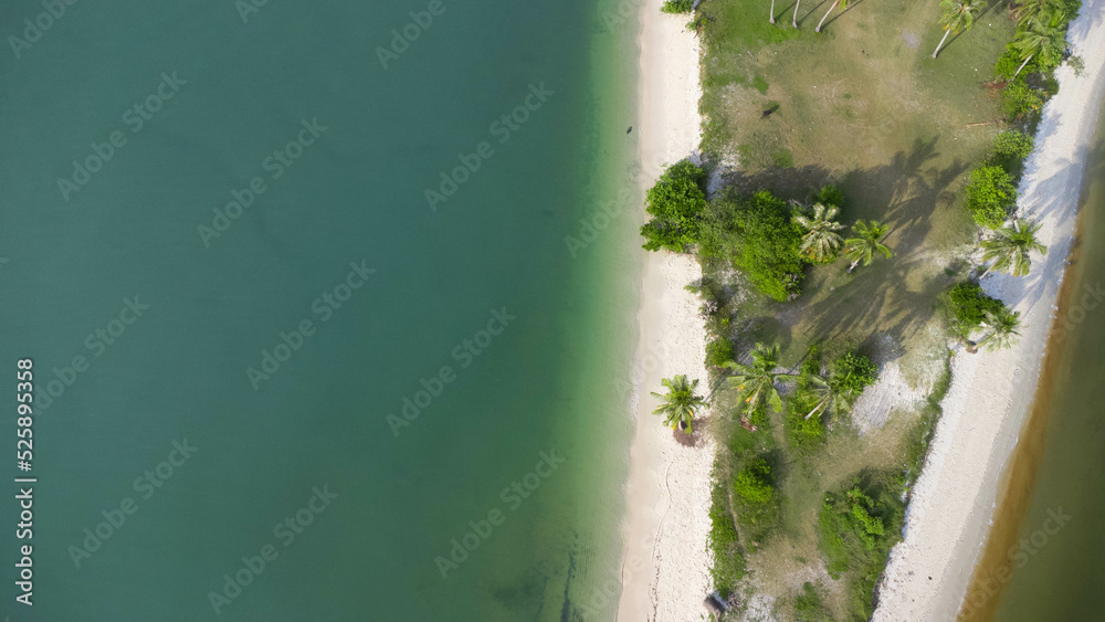 Sandy beach jutting out into the middle of the sea with beautiful water ...