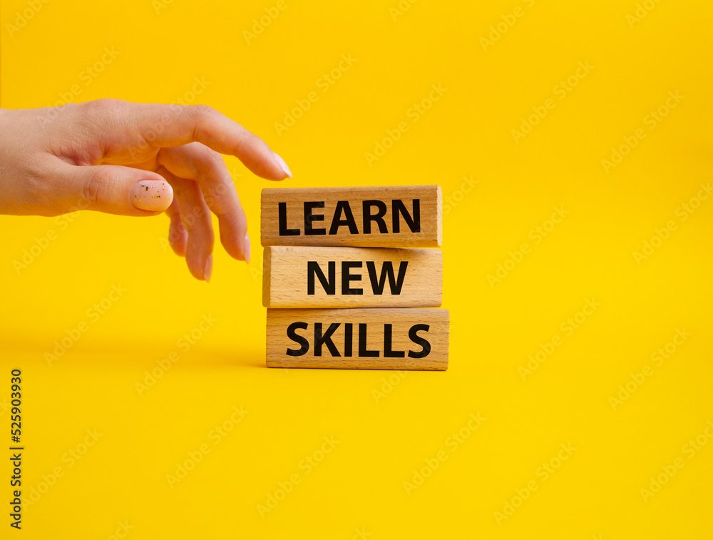 Learn new skills symbol. Concept words 'Learn new skills' on wooden ... Learn new skills symbol. Concept words 'Learn new skills' on wooden ...
