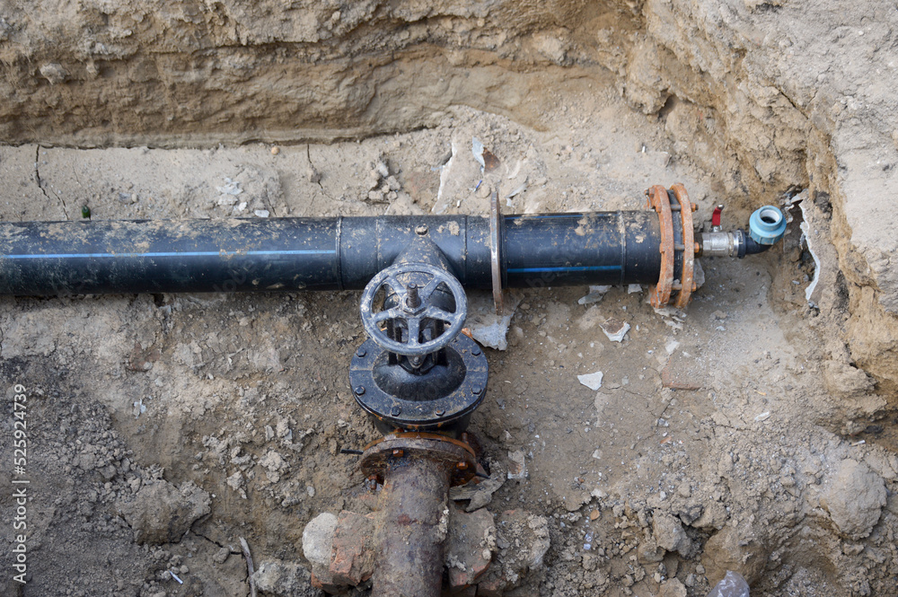 repair of urban underground communications and pipes. in a dug trench ...