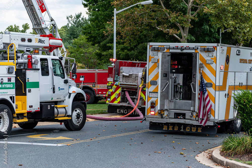 Fire department and PEPCO utility company apparatus at the scene of a ...