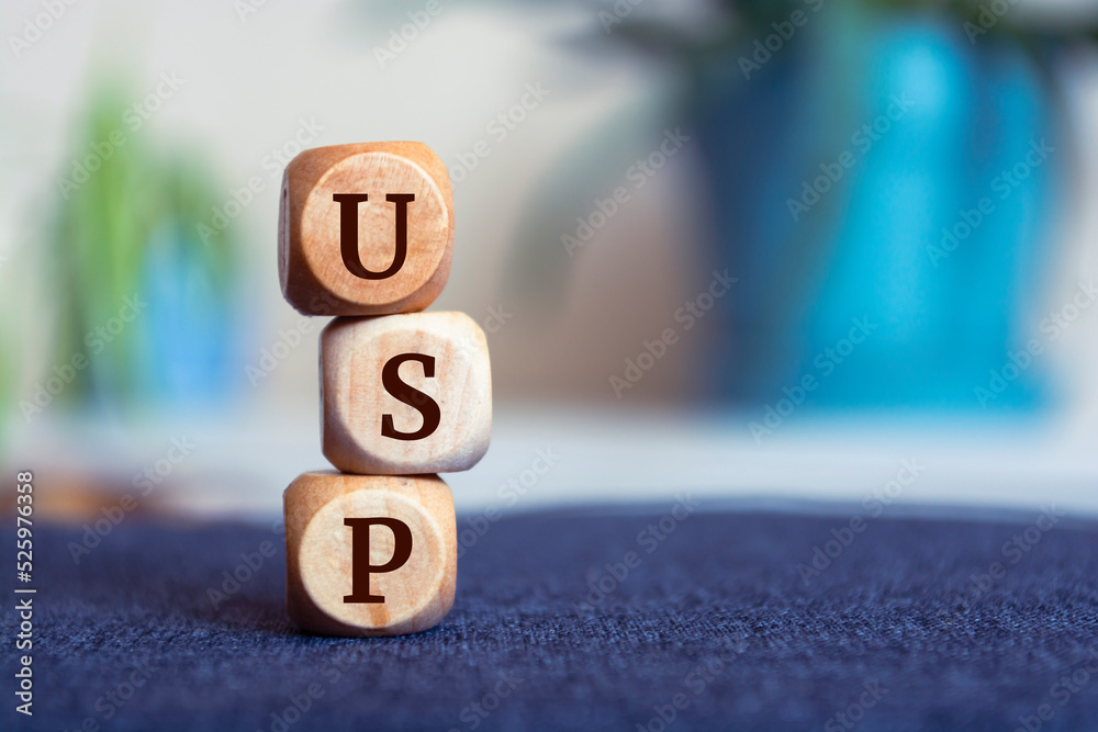 Cubes and dice with acronym USP unique selling proposition or unique ...