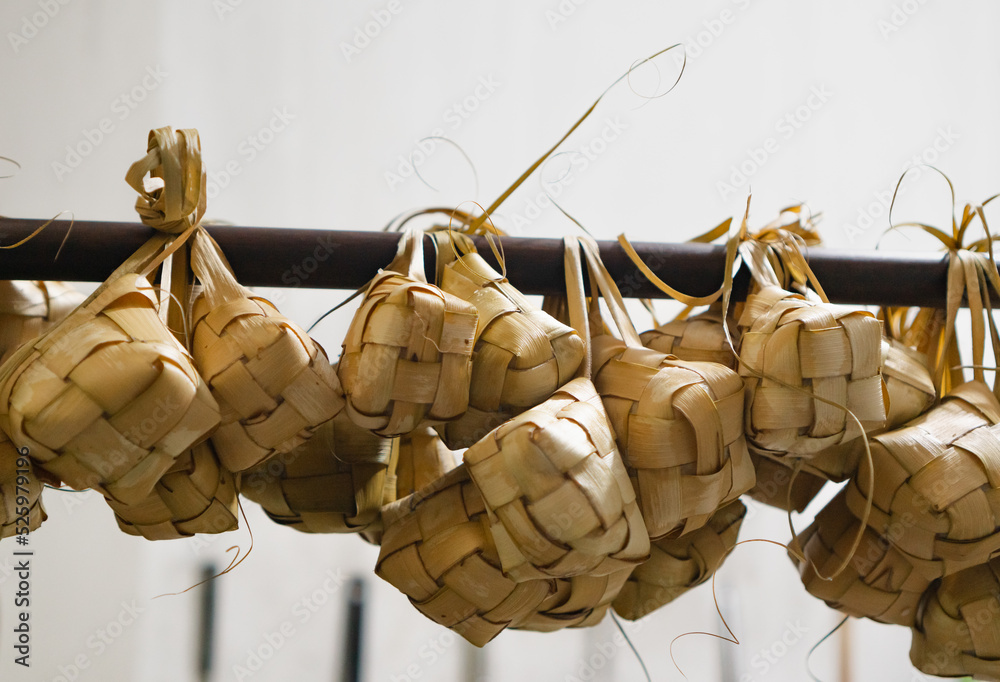 ketupat, rice cake packed inside a diamond-shaped container of woven ...
