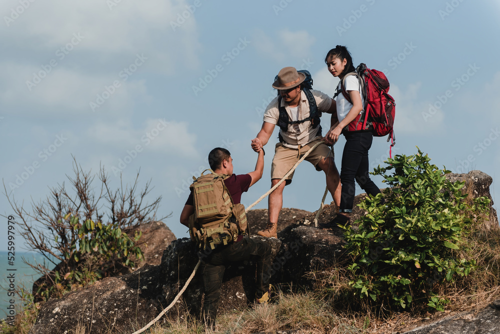 Three Asian teenagers, mountain climber, trekker and traveler ...