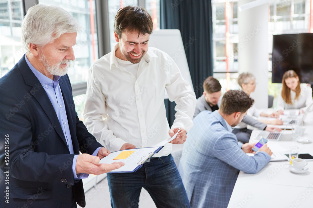 Manager and businessman checking a checklist Stock Photo | Adobe Stock