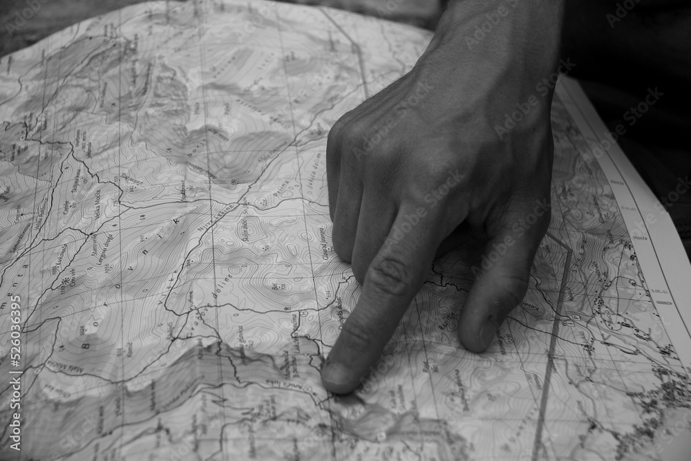 Grayscale Of A Hand Pointing A Location On A Map Stock Photo Adobe Stock