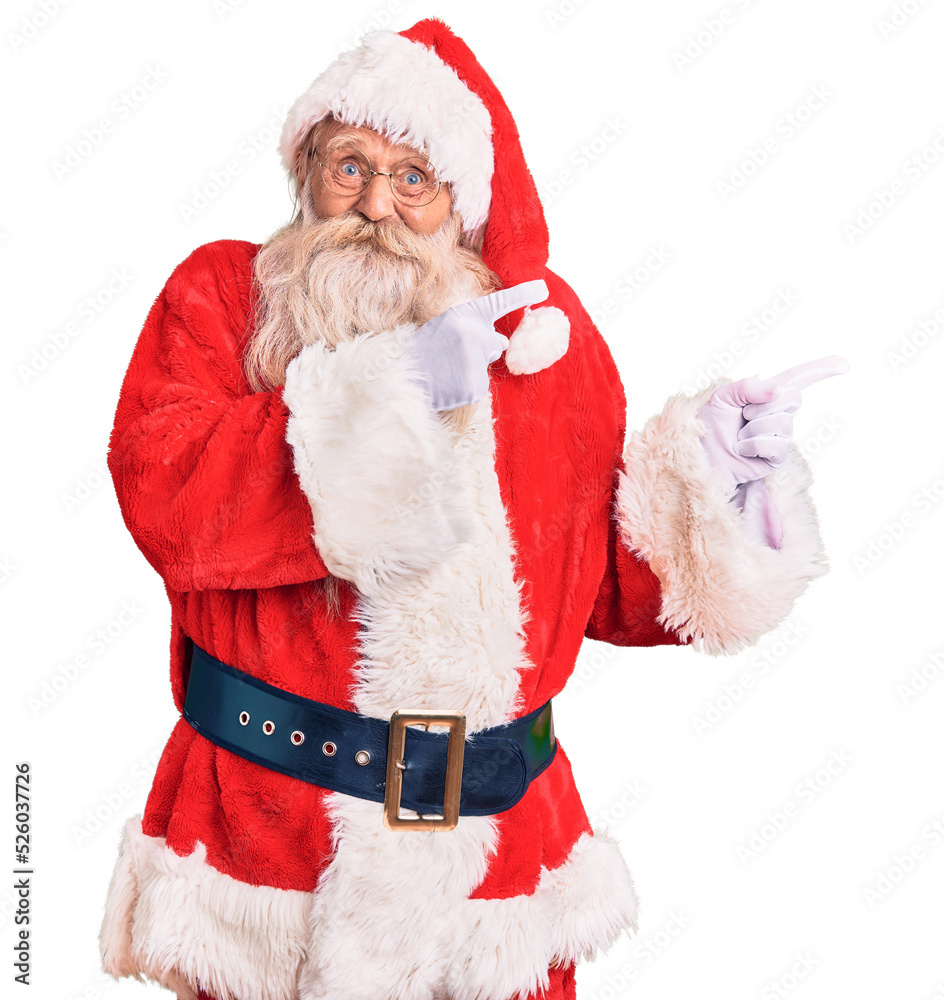 Old senior man with grey hair and long beard wearing traditional santa ...