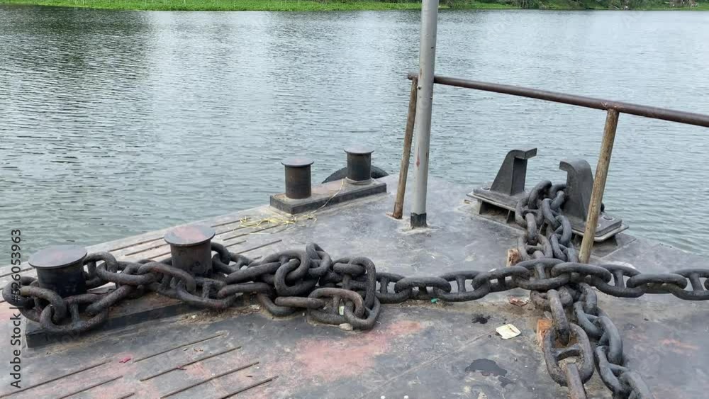 Anchor chain are tied to mooring bollards to hold passenger ferry boats ...