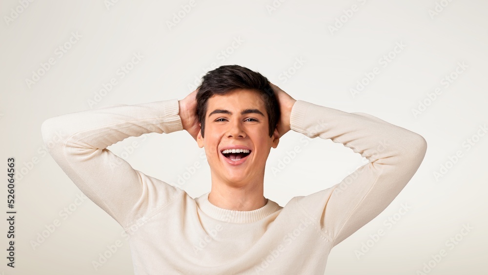 Excited shocked man holding hands on face and screaming looking at ...