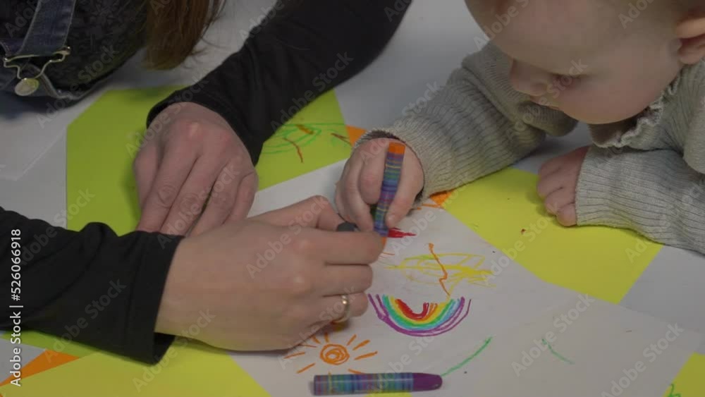 Woman and her daughter concentrated on painting process Stock Video ...