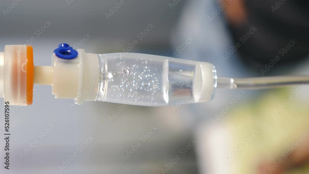 Medical dropper close-up. Vertical footage. Drop of Saline Dripped for ...