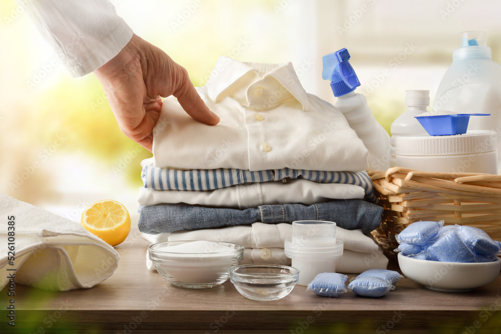 Products and person showing freshly washed clothes in a room Stock ...