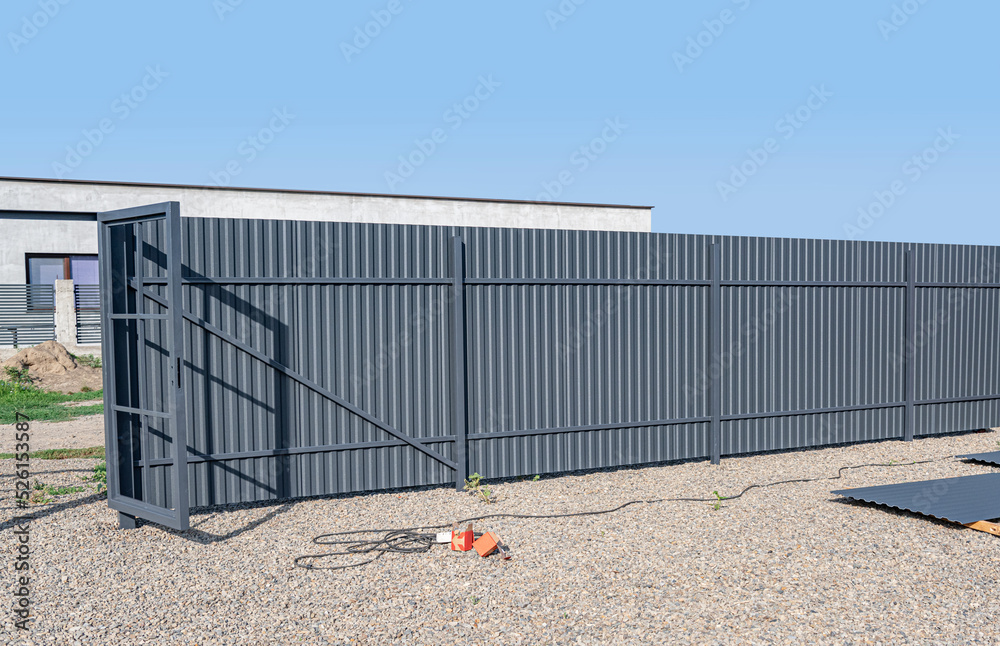 Installation of metal gates. Gate from a profile pipe in the process of ...