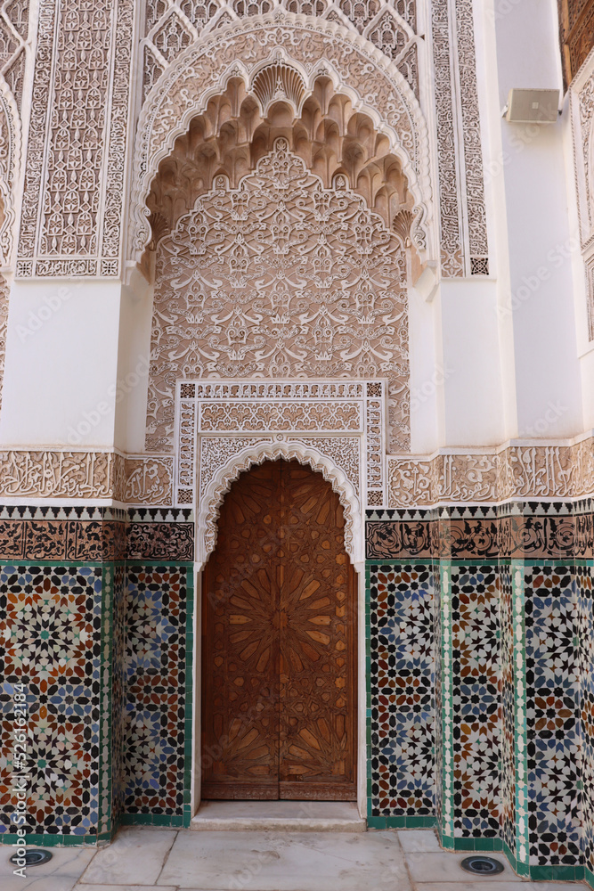 Arabic wooden door with arch and colorful tiles. Typical Moroccan ...