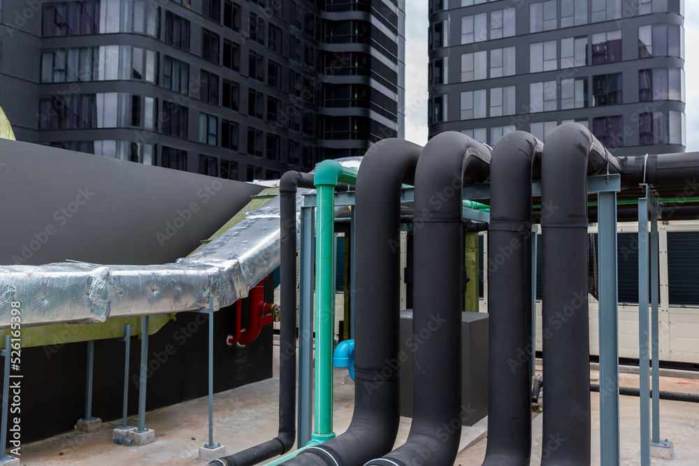 Foto de Pipe of air conditioner system on roof. a lot of pipe for air ...