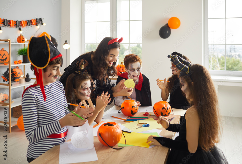 Art and Craft studio leader enjoying creative activity with children ...