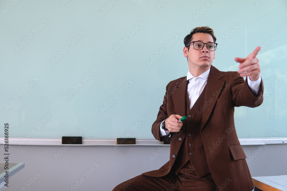Very smartly dressed college professor pointing to the class. Caucasian ...