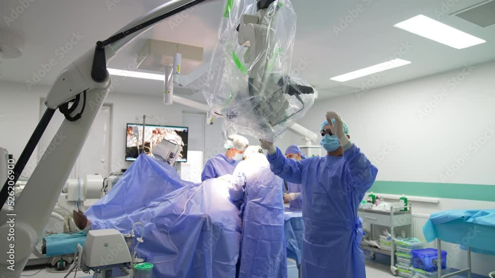 Surgical procedure in progress. Team of doctors working in the ...