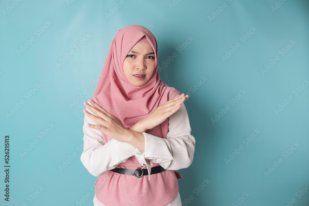 Beautiful Asian Muslim woman with hand gesture pose rejection or ...