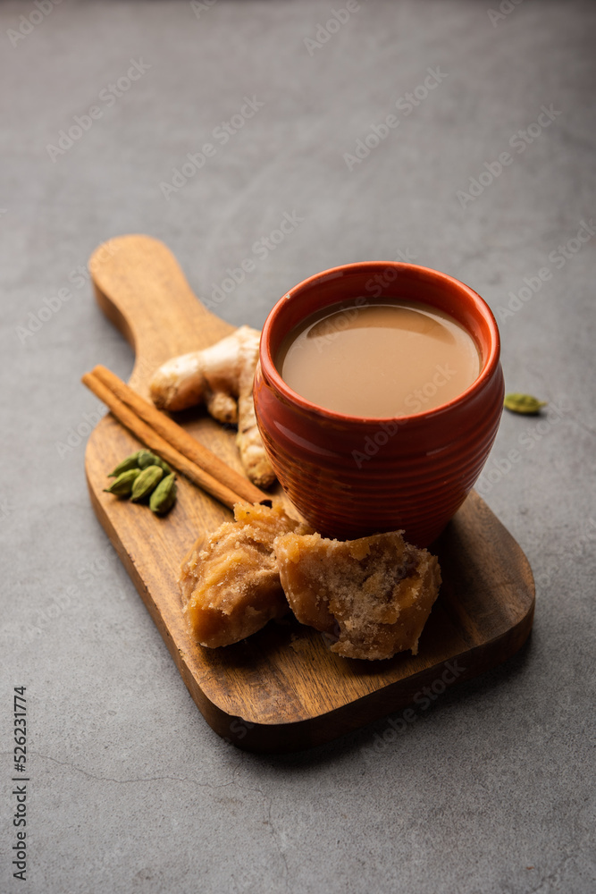 Jaggery tea or Gur ki chai with ingredients like gud, ginger or adrak ...