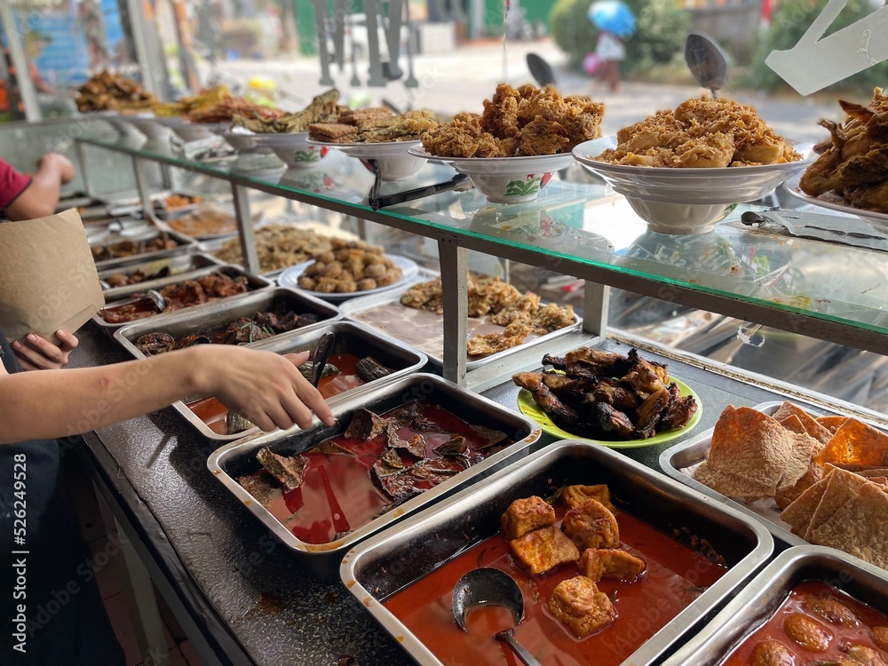 Padang food stalls share a variety of buffet menus with vegetables ...