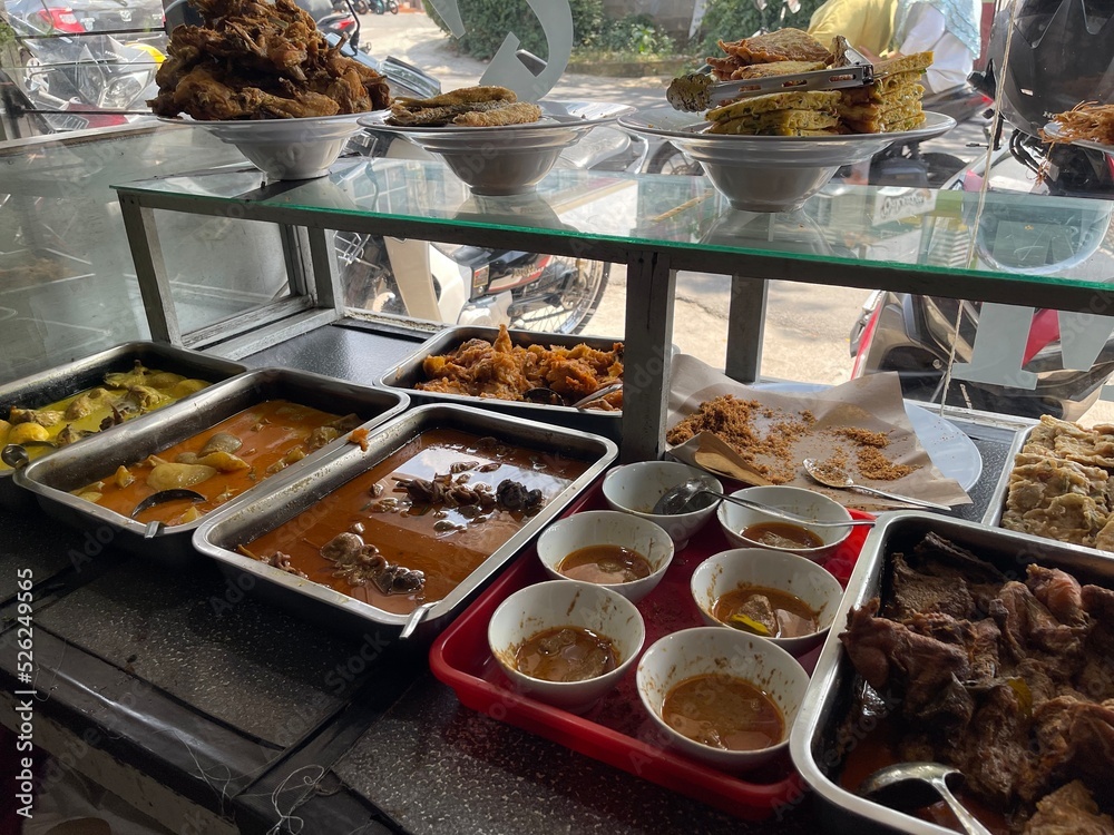 Padang food stalls share a variety of buffet menus with vegetables ...