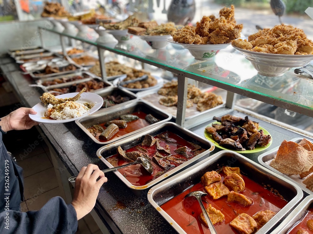 Padang food stalls share a variety of buffet menus with vegetables ...