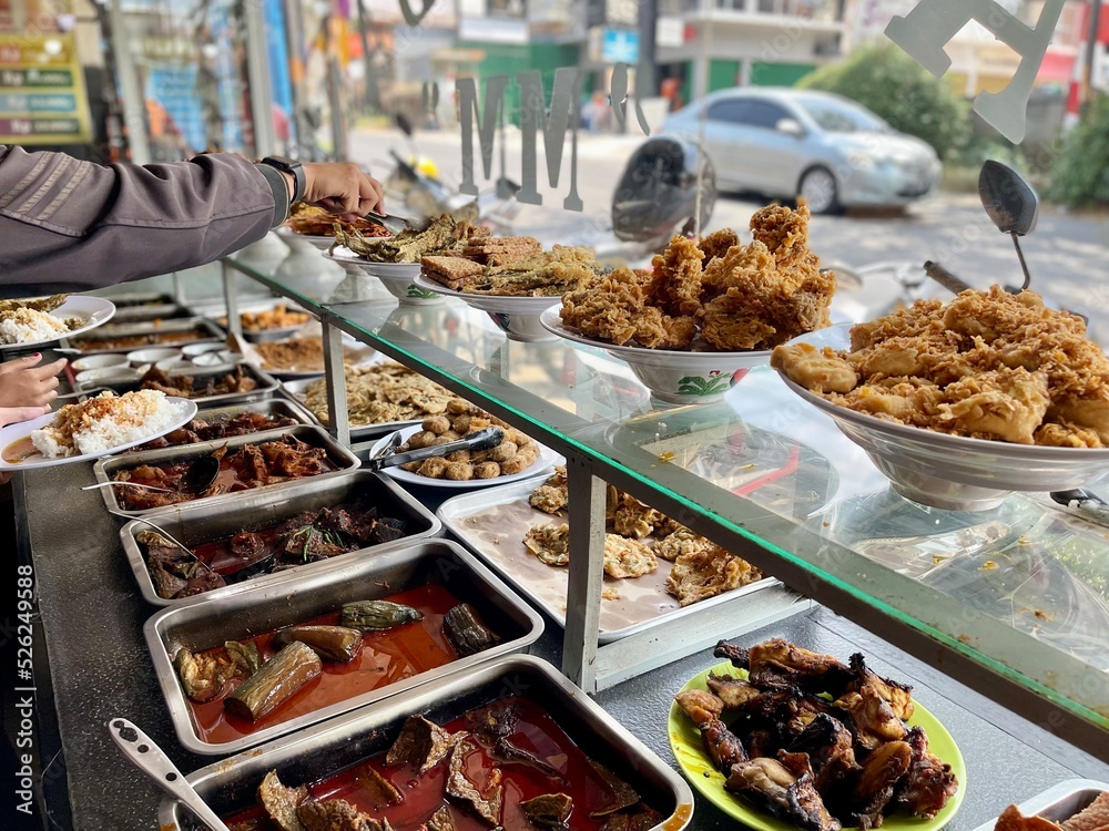 Padang food stalls share a variety of buffet menus with vegetables ...