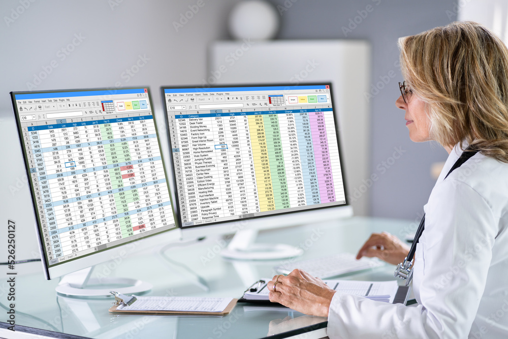 Hospital Doctor Using Spreadsheet For Billing Codes Stock Photo | Adobe ...