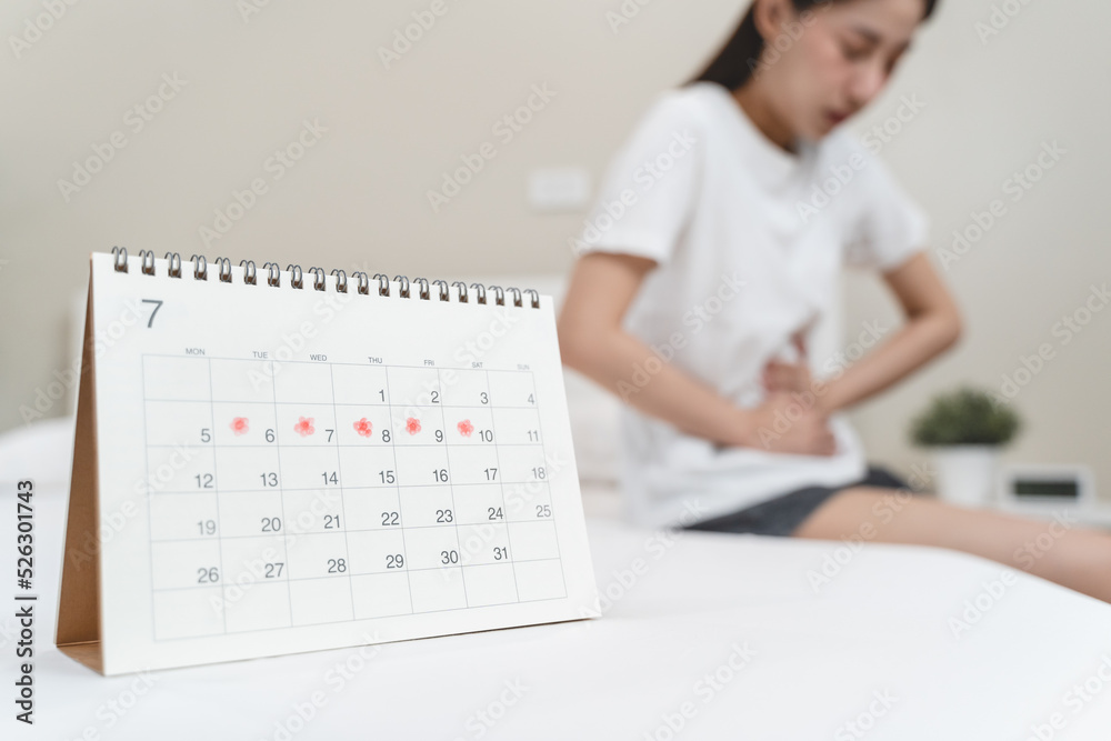 Monthly menstruation symptom period concept. Close up calendar marking ...