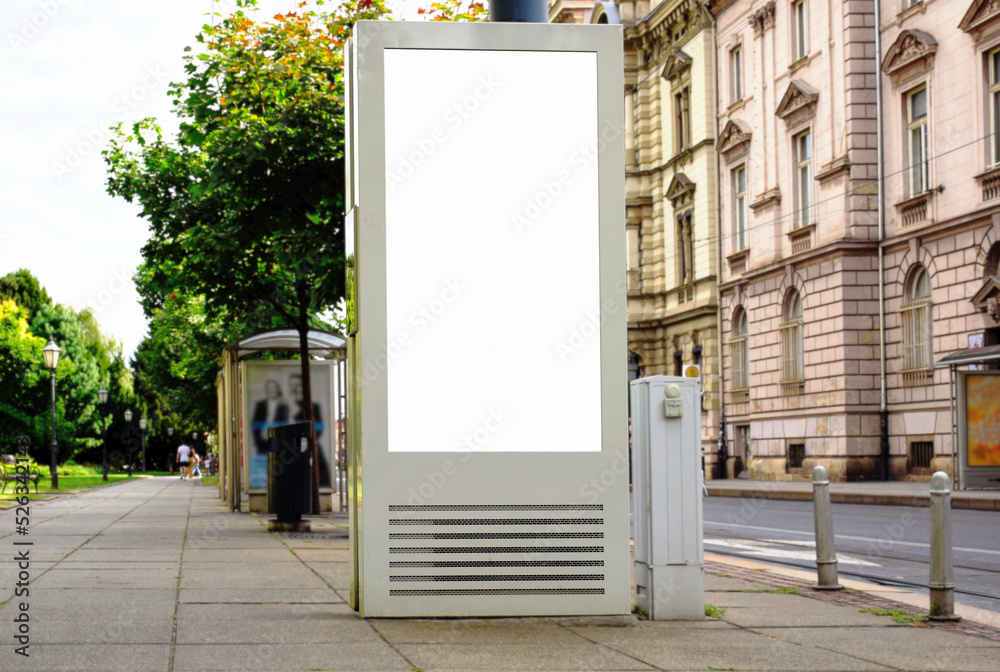 empty white billboard and ad panel, lightbox. urban setting with green ...
