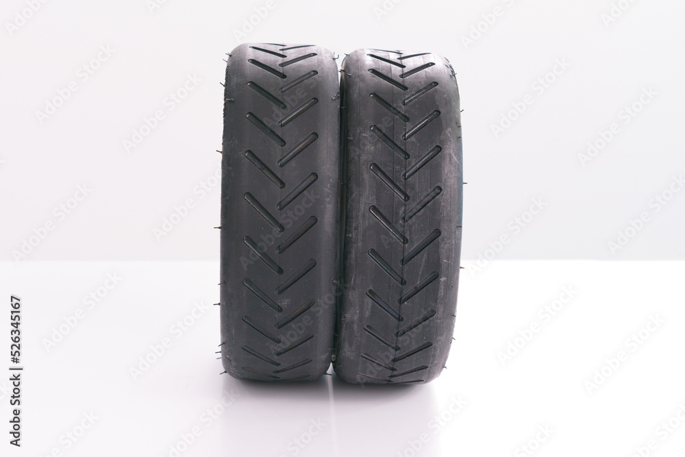 Two small scooter tire stands on a white background. Wheel. Rubber ...