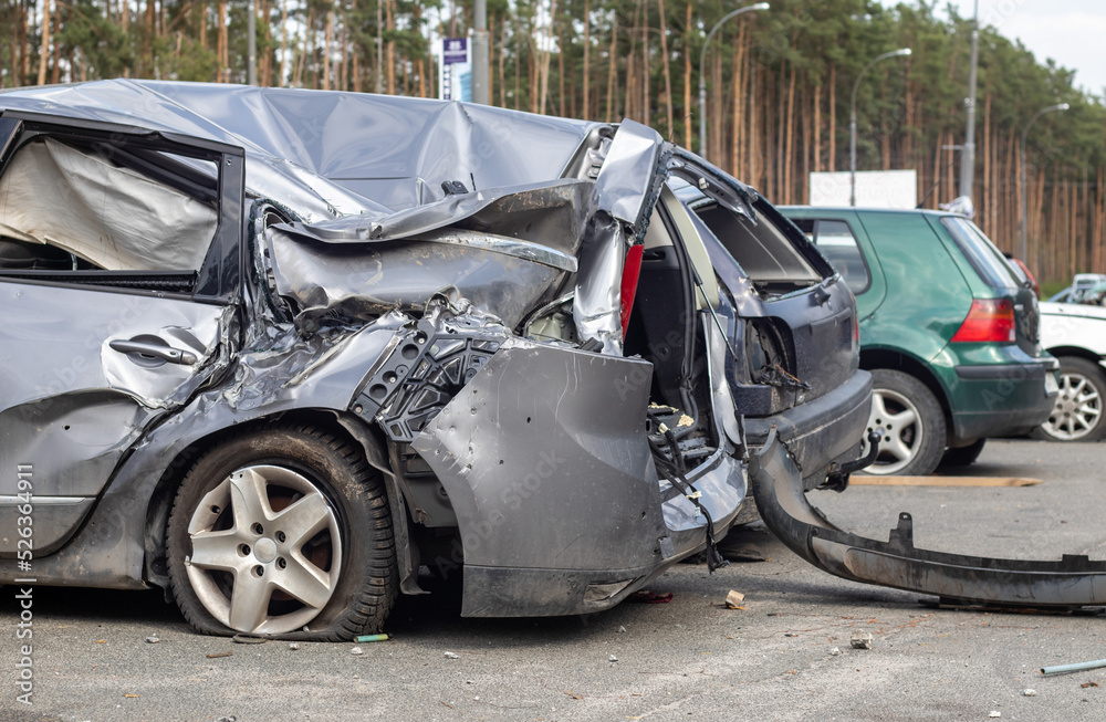 Shot, damaged cars during the war in Ukraine. The civilian car was ...