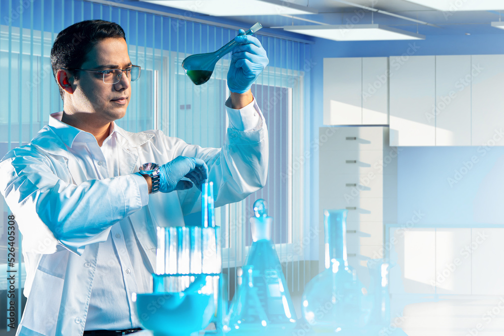 Man is scientist. Young scientist is doing research. Man with test tube ... Man is scientist. Young scientist is doing research. Man with test tube ...