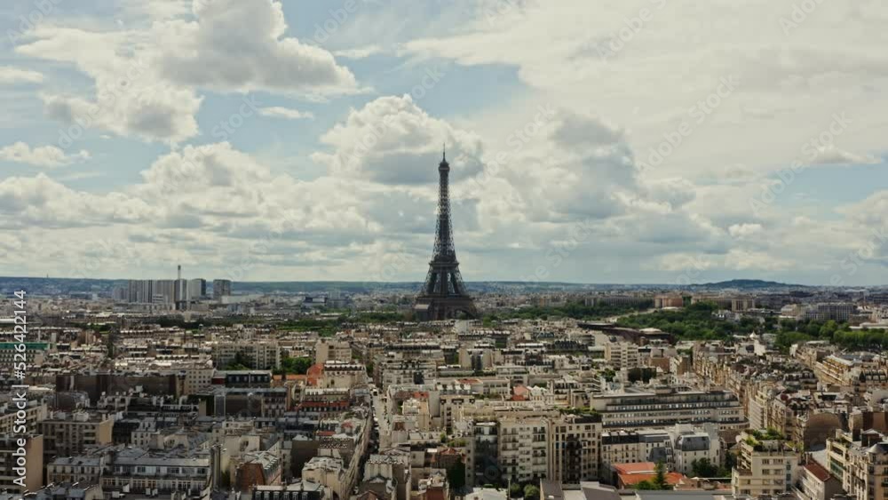 The Eiffel Tower rises above the city blocks of Paris. Cityscape of the ...