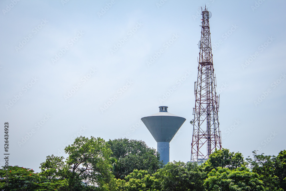 Communication tower with sky background with a water tank nearby Stock ...