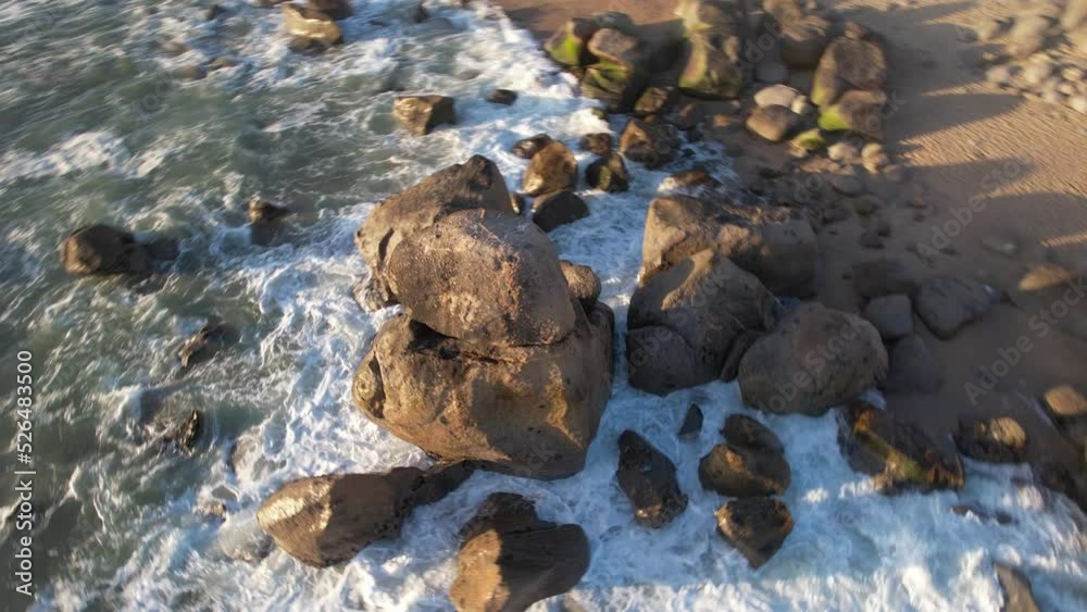 Areal view of the Atlantic ocean hitting the granite rocks on the ...