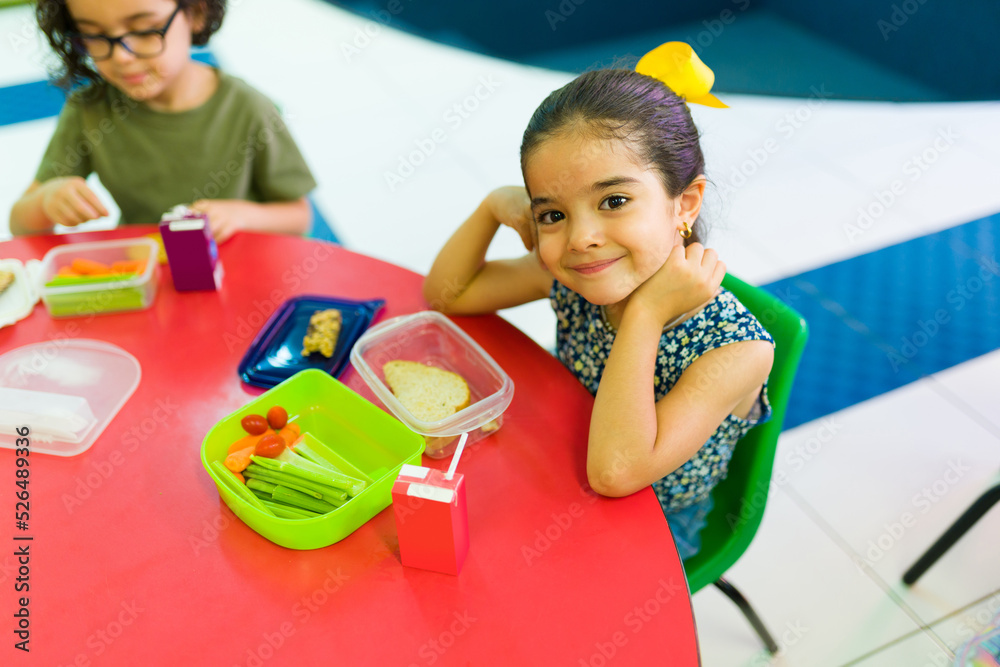 Beautiful cute girl on her lunch break at preschool Stock Photo | Adobe ...
