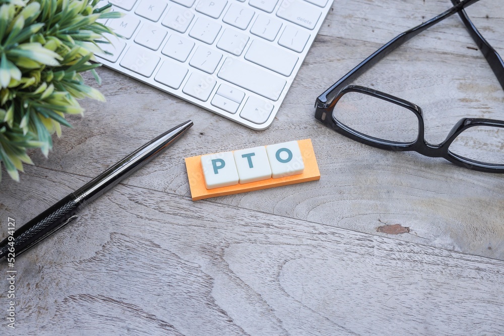 PTO or Paid Time Off concept. Focus on the word PTO written on the ...