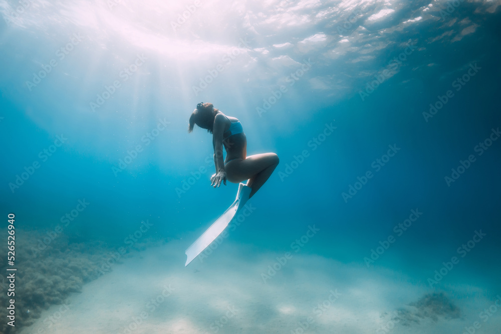 Lady freediver in bikini posing underwater in blue ocean Stock Photo ...
