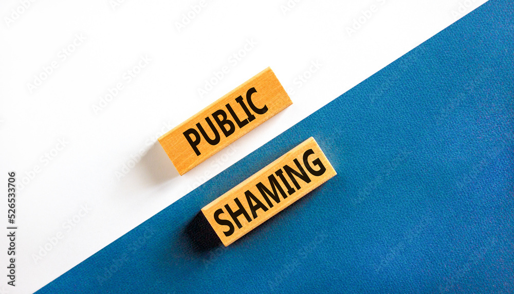 Public shaming symbol. Concept words Public shaming on wooden blocks on ...