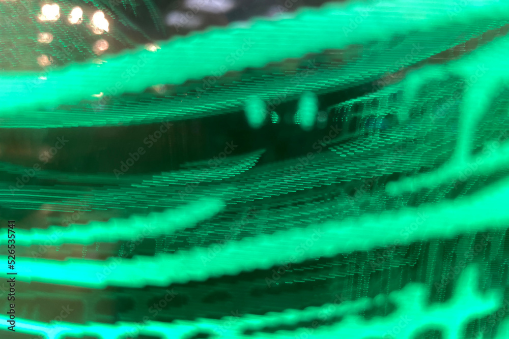 Fluted texture. Neon green light background. Metal surface with a ...