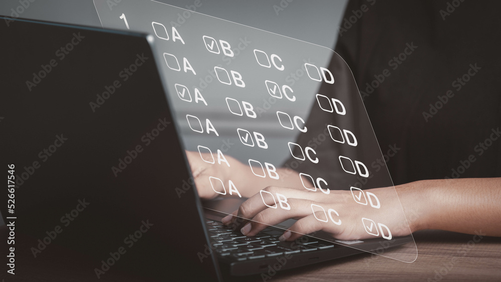 Students taking online exams by laptop. Virtual test or questionnaire ...