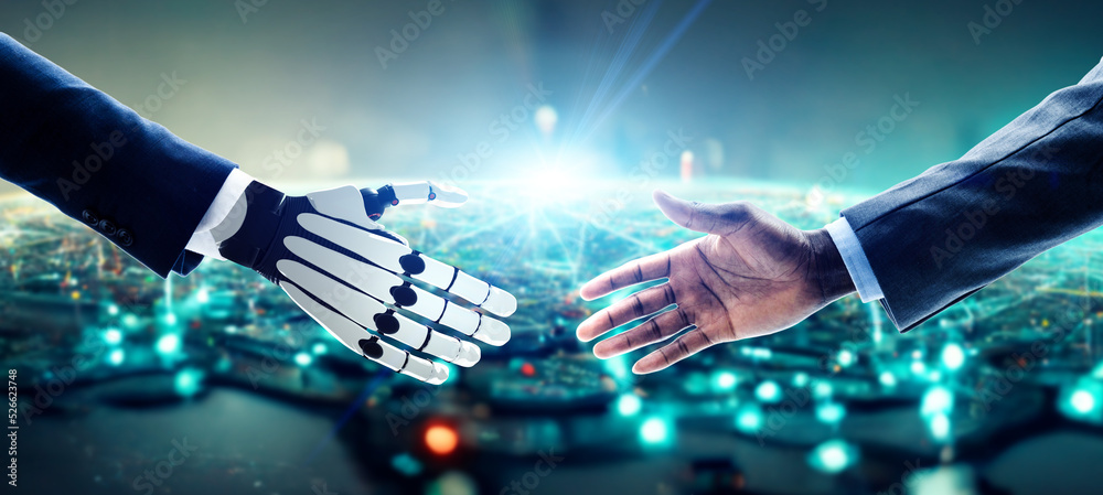 A human and a robot shaking hands. AI. artificial intelligence. Wide ...