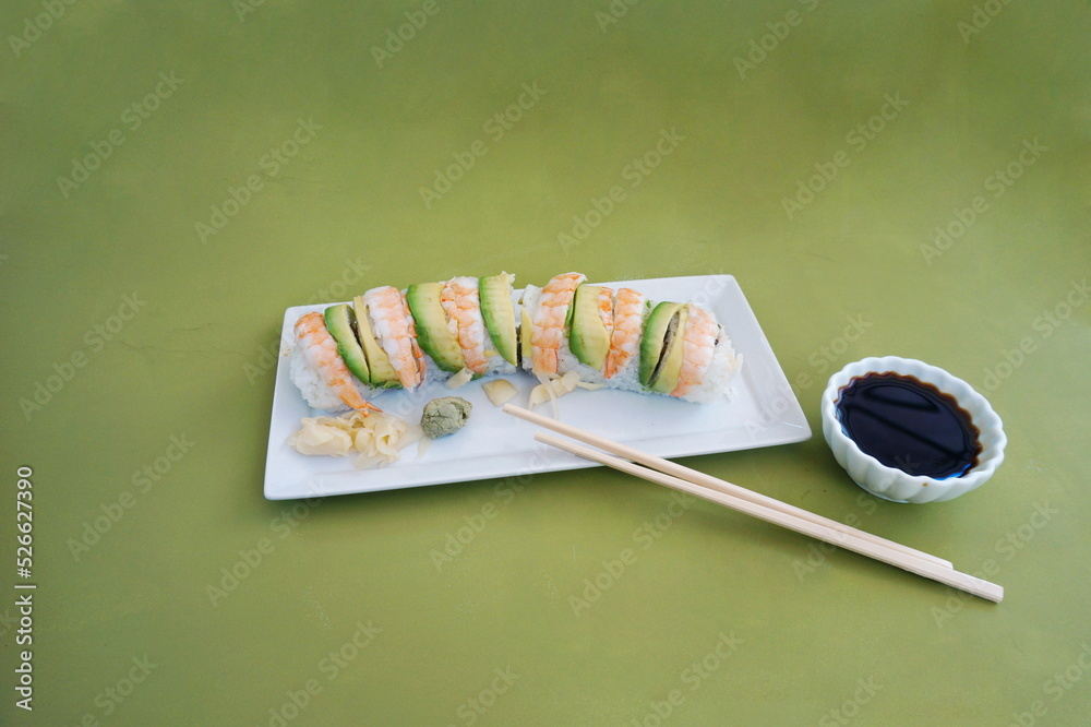 Shrimp and Avocado Tiger Roll on White Oblong Dish with Soy Suace ...