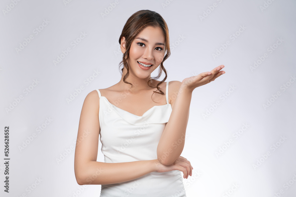 Photo of a gorgeous woman with flawless healthy fresh skin in a concept of empty space for ...