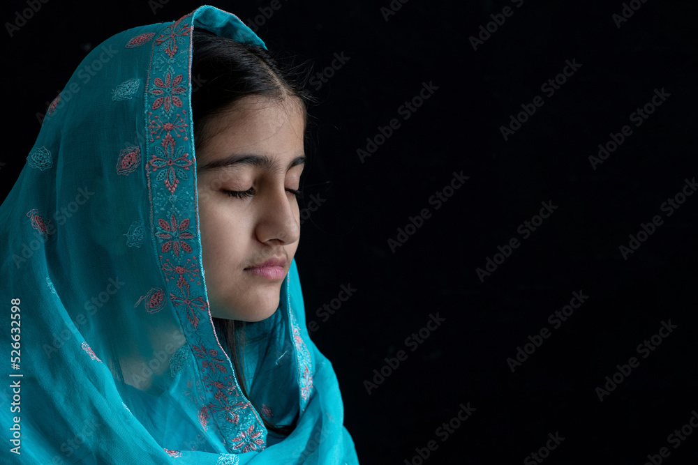 Little Muslim girl wearing blue hijab and close her eyes, black ...