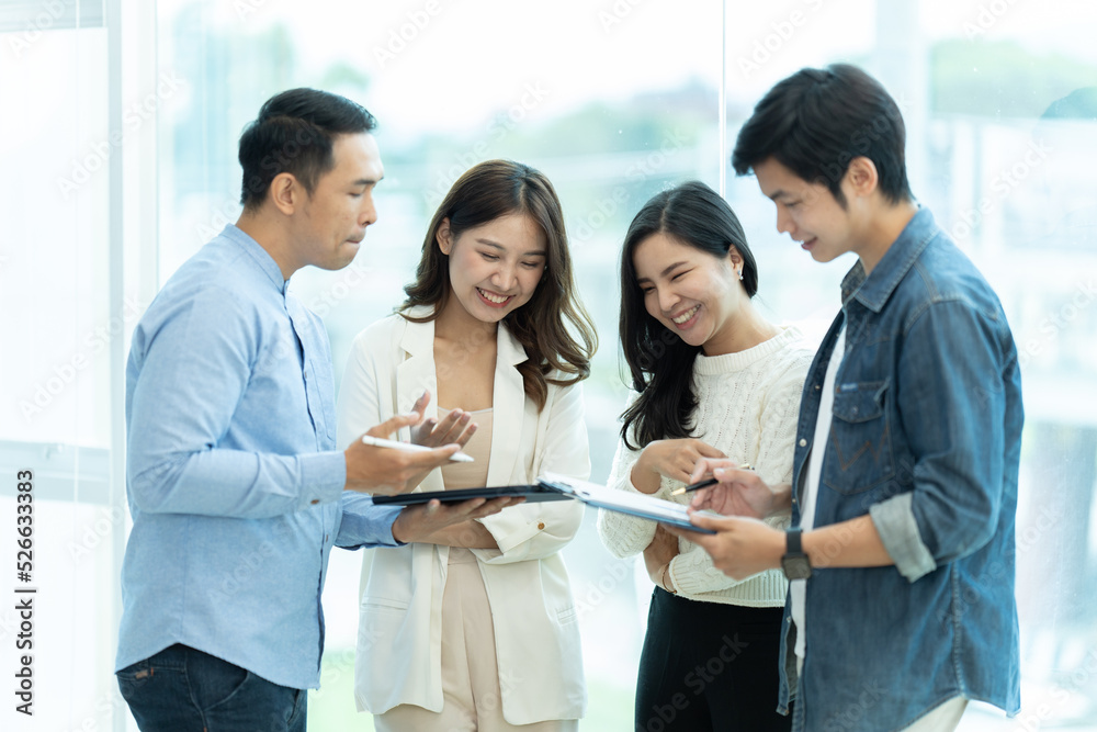 Business people showing team work while working in board room in office ...
