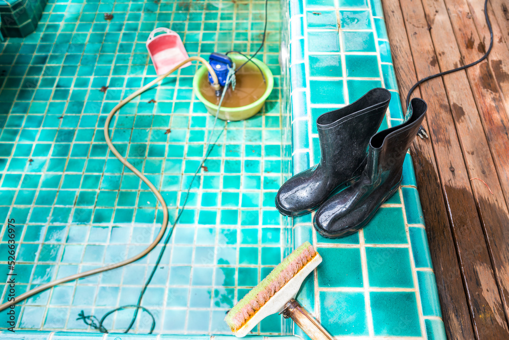 Safety boot on swimming pool with cleaning tool, remove dirty water ...