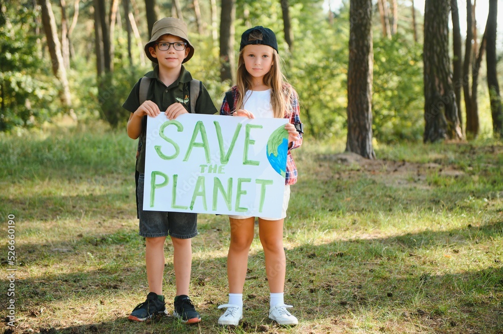 Children are holding a poster: Save the planet. Earth Day. Let's save ...